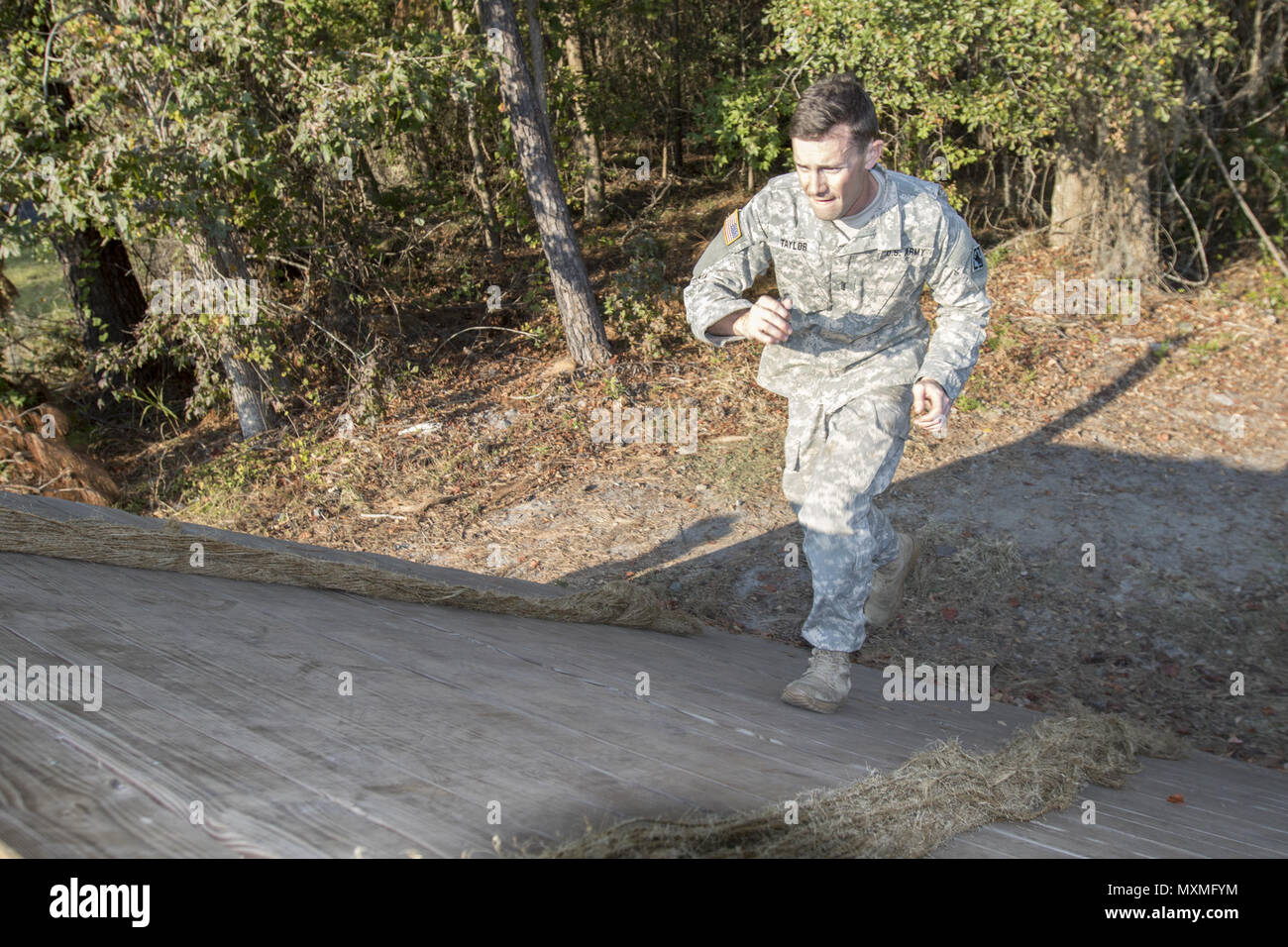 1st. Lt. Taylor 92nd Engineer Battalion sprints up the modified weaver ...