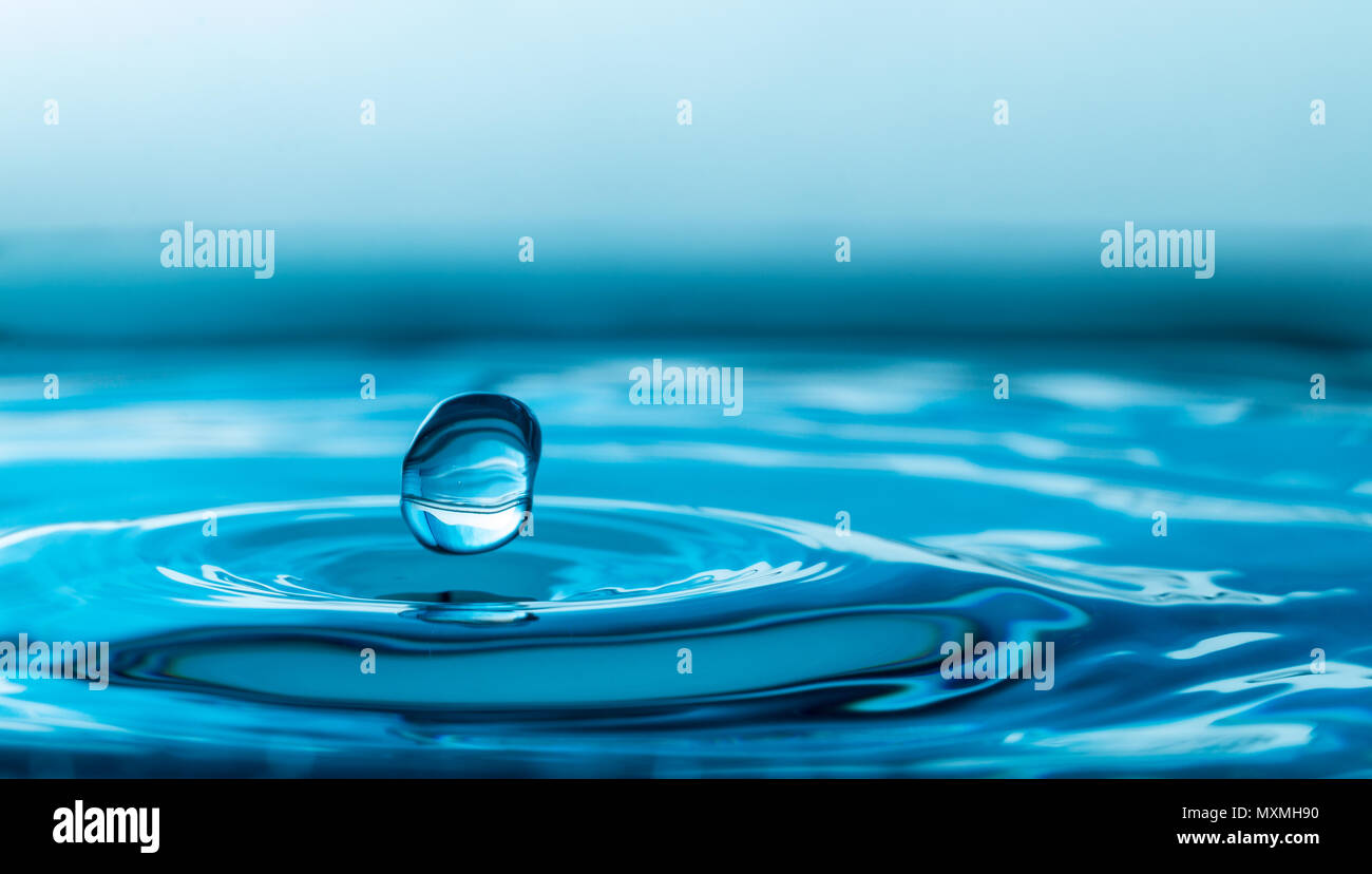 colorful water drop splash Stock Photo - Alamy