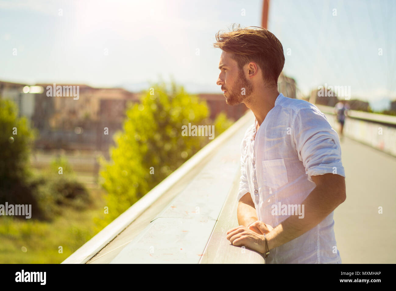 One handsome young man in city setting Stock Photo - Alamy