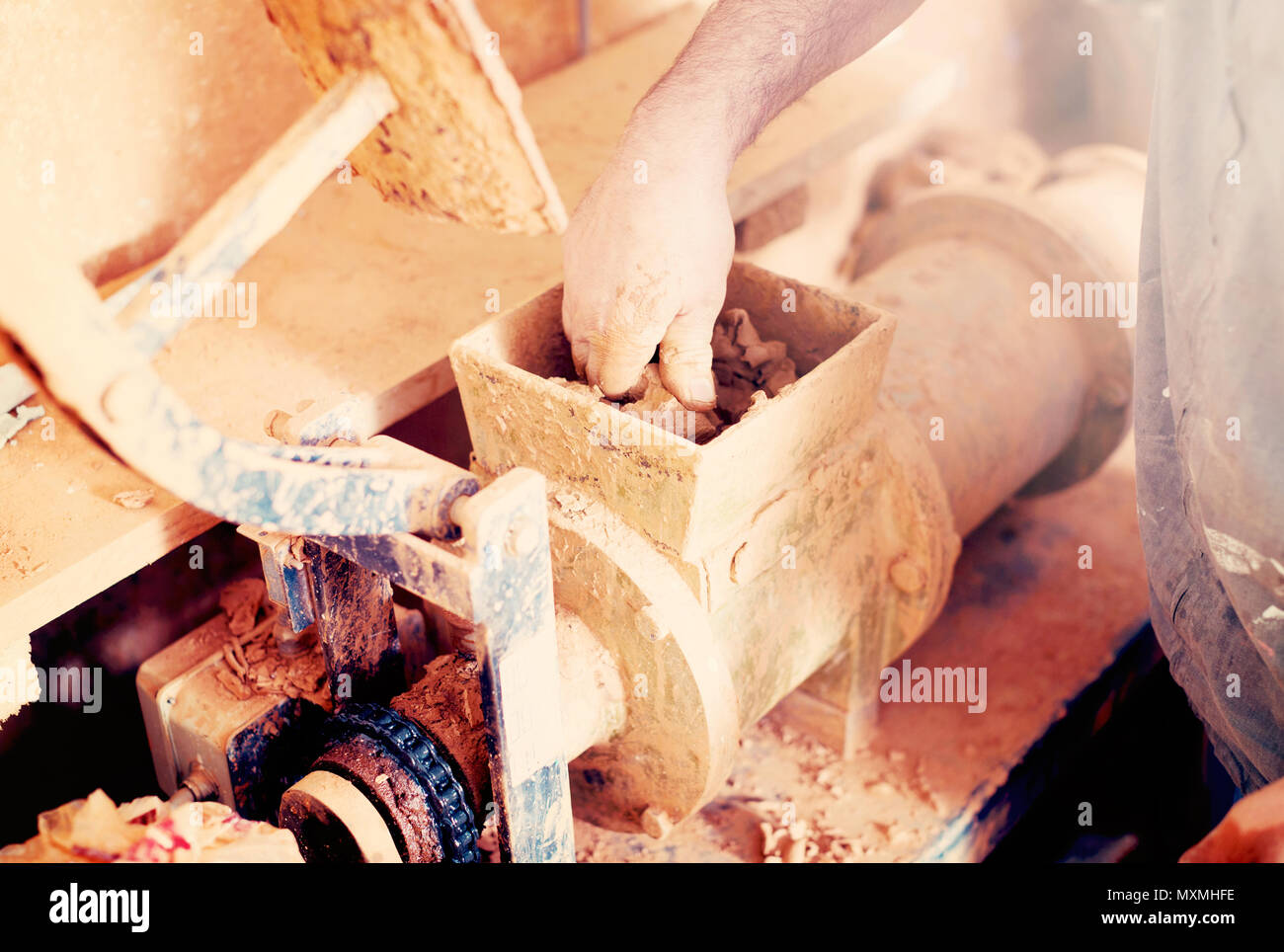 Closeup view on clay forming machine in ceramics studio Stock Photo - Alamy