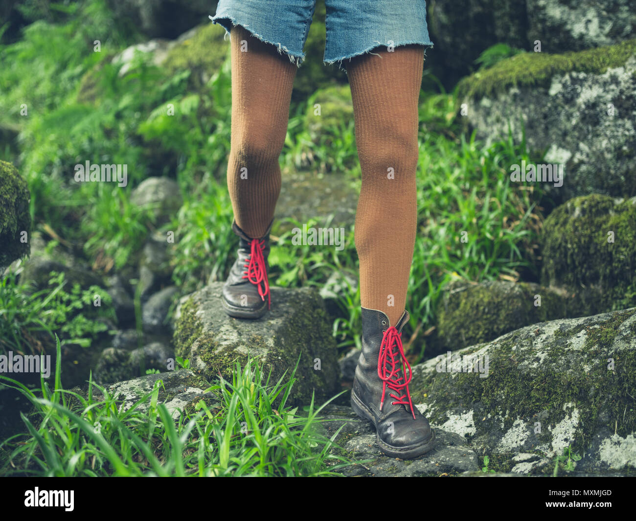 Female legs in red boots hi-res stock photography and images - Alamy