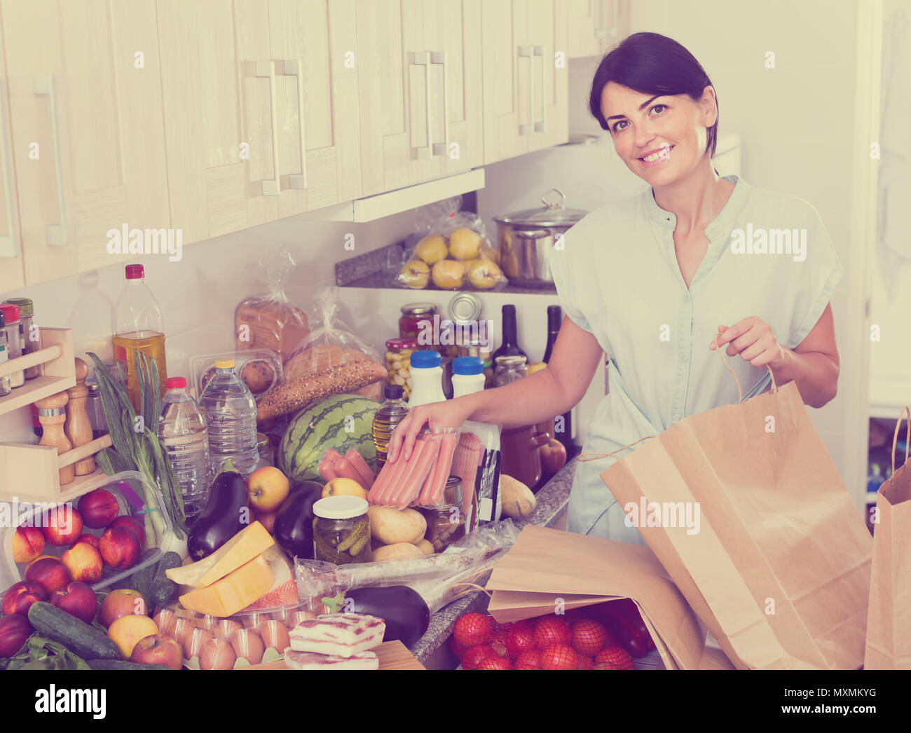 Portrait of cheerful germany woman who is readying for cooking new ...