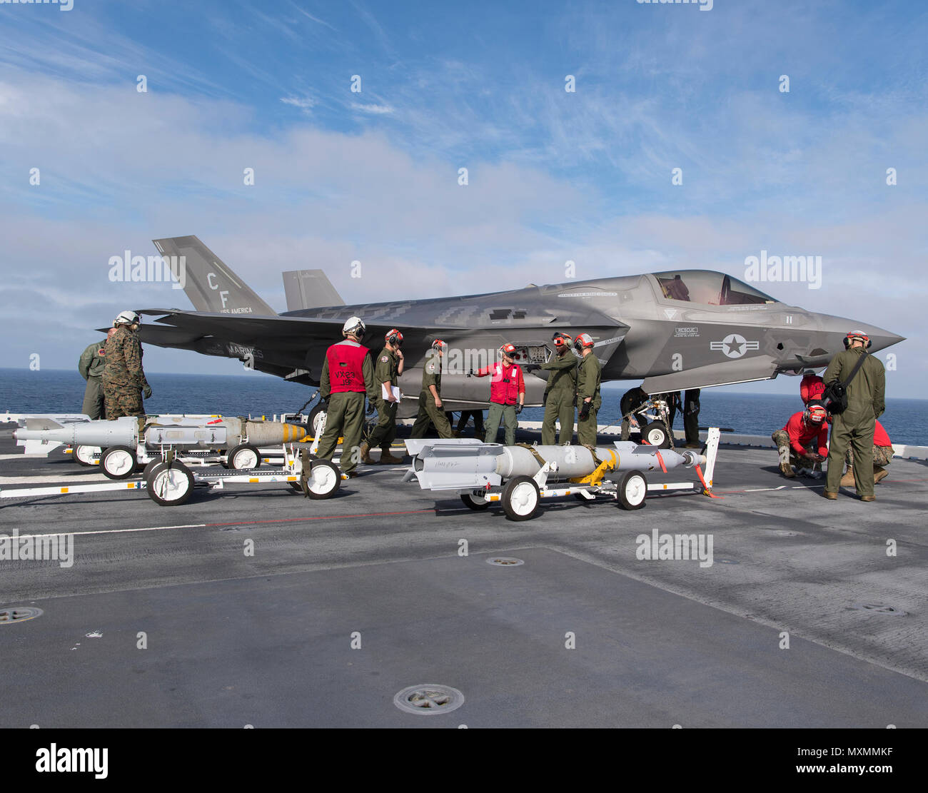 An F-35B Lightning II STOVL aircraft is prepared for live ordnance ...