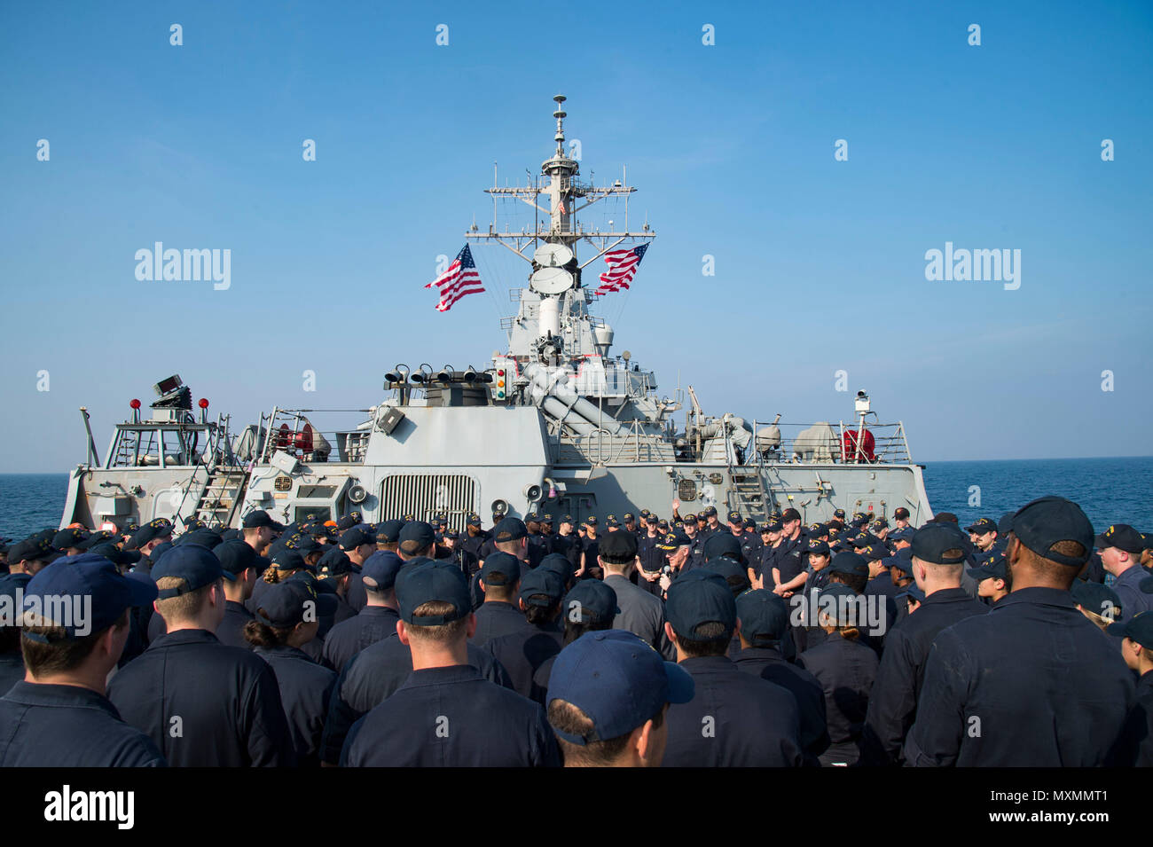The crew of the guided-missile destroyer USS Hopper (DDG 70) conducts ...