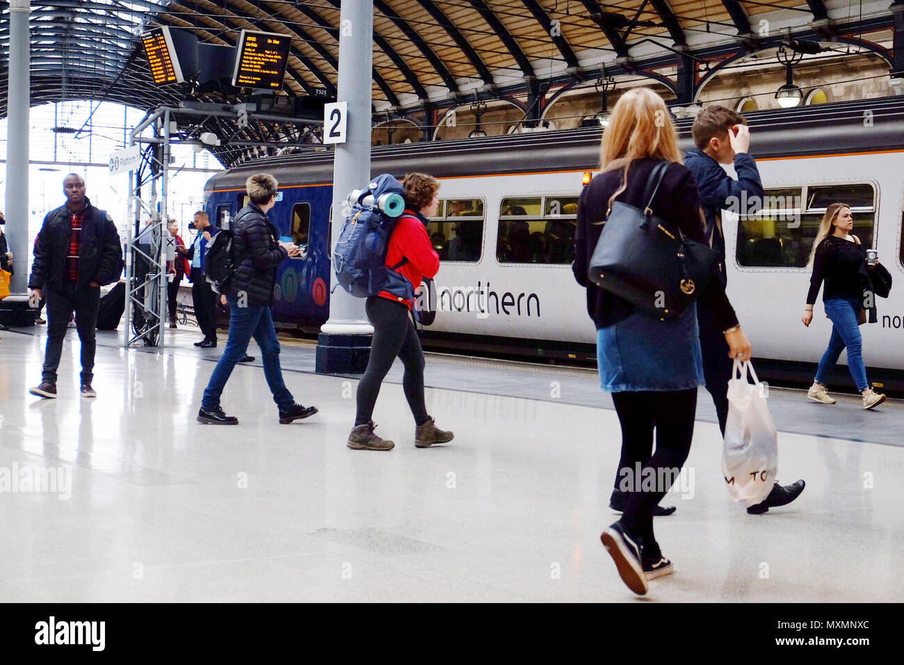 Passengers and a Northern train at Newcastle upon Tyne railway station ...