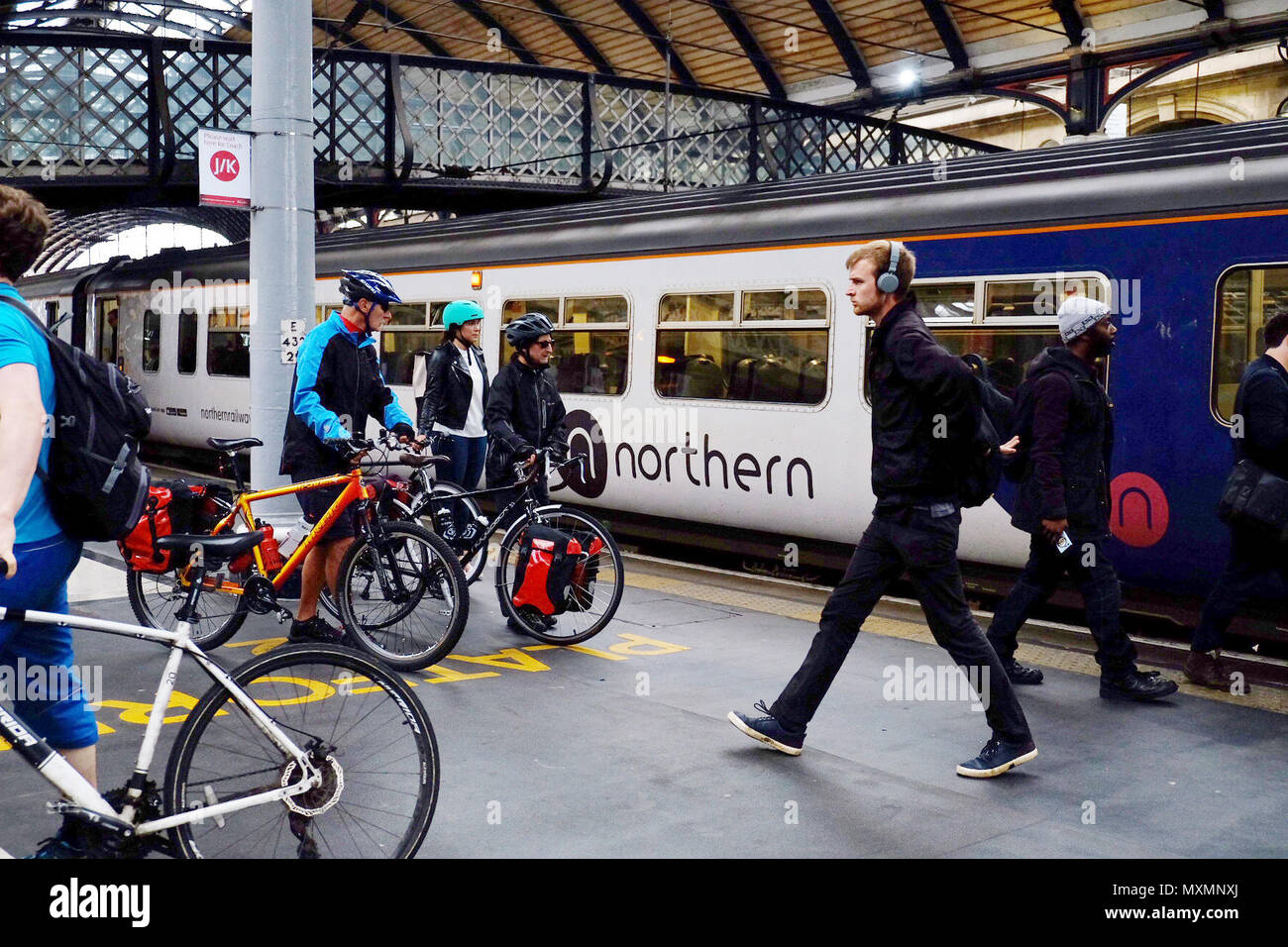 Passengers and a Northern train at Newcastle upon Tyne railway station ...