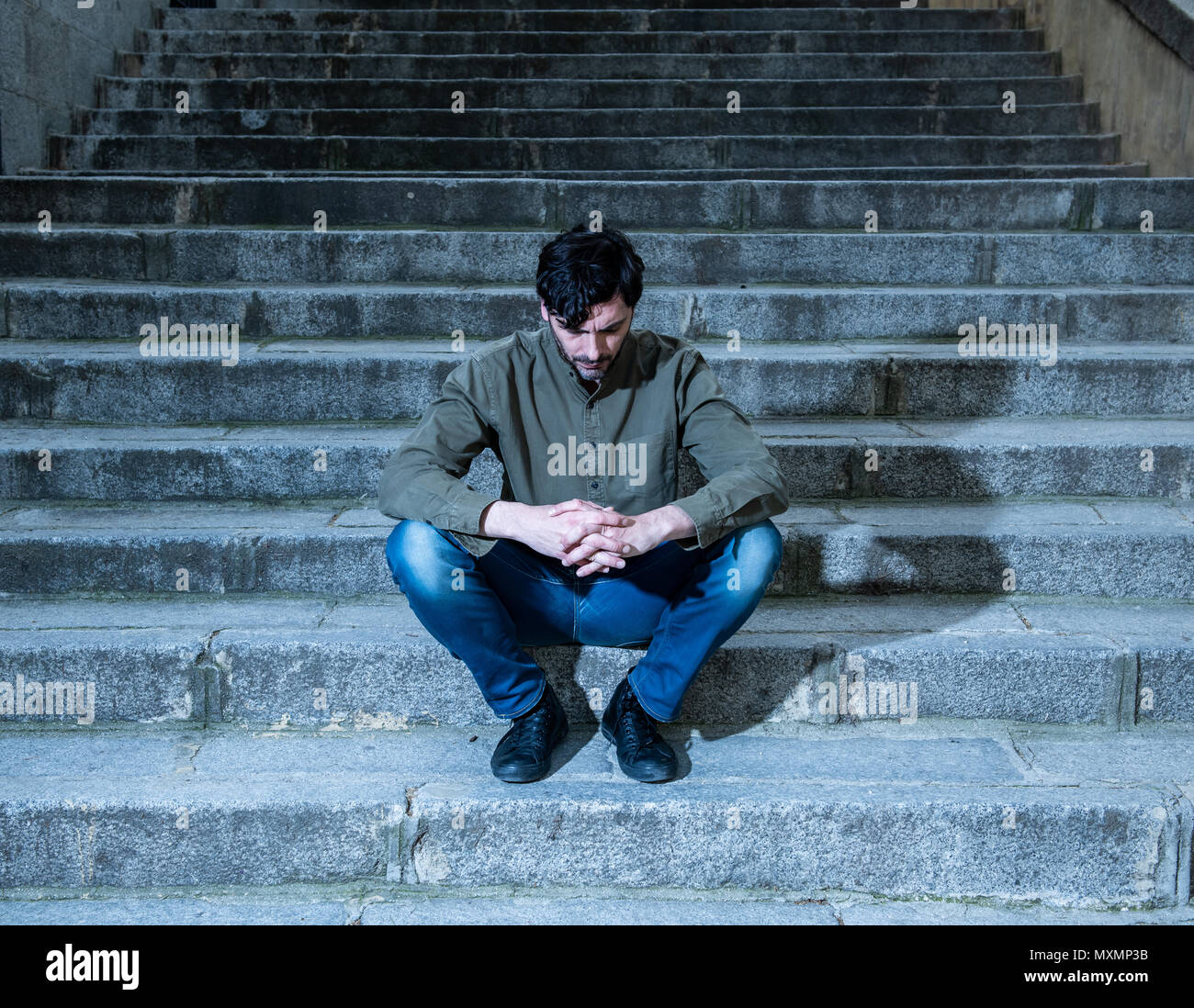 Stressed man sitting hi-res stock photography and images - Alamy