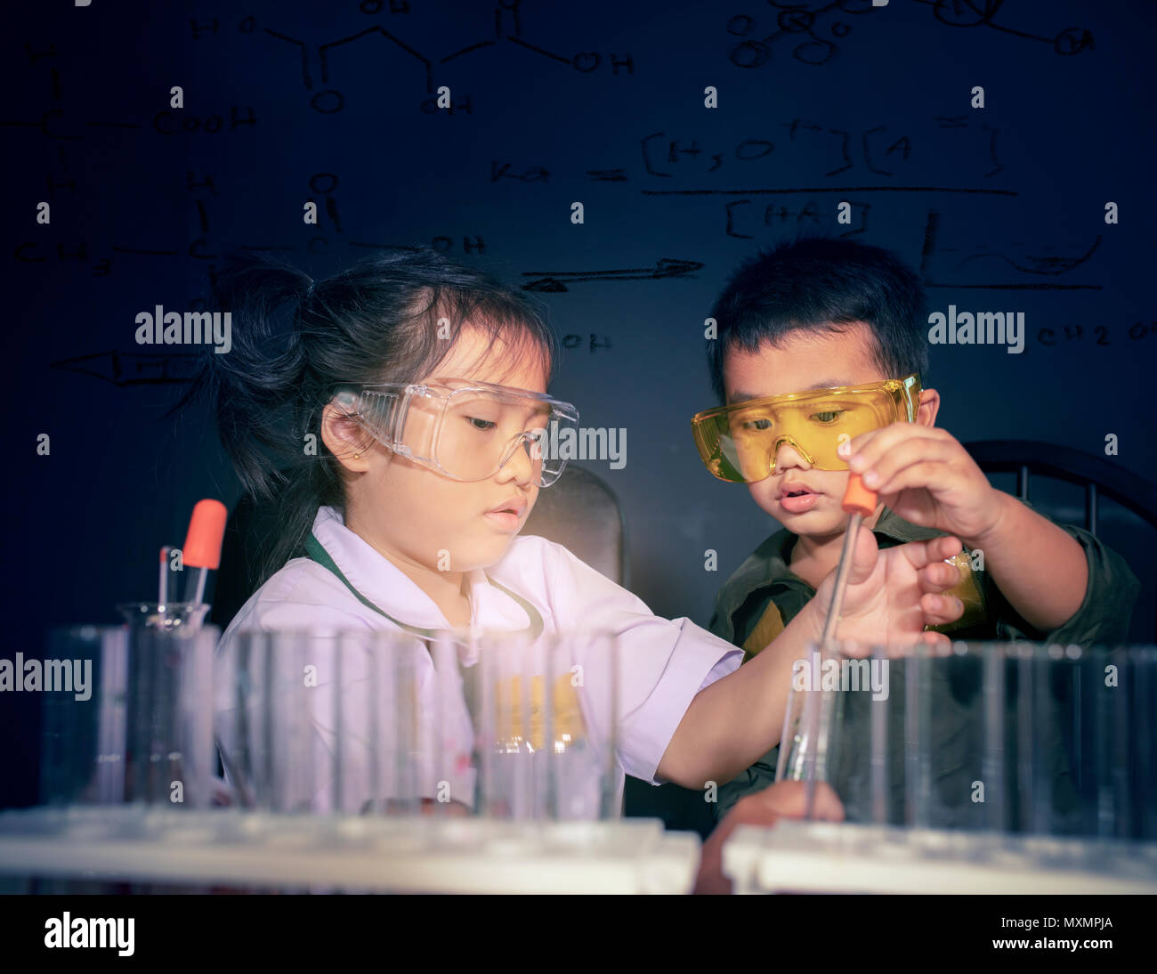 asian children in science examination laboratory Stock Photo - Alamy