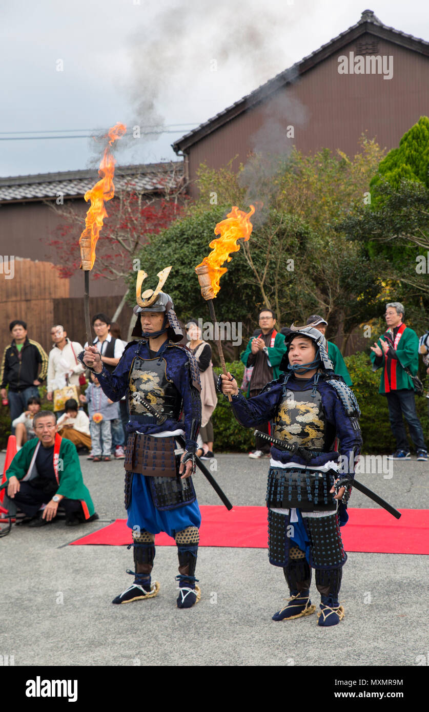 Two samurai wait to be called to light the torches at the 27th annual ...