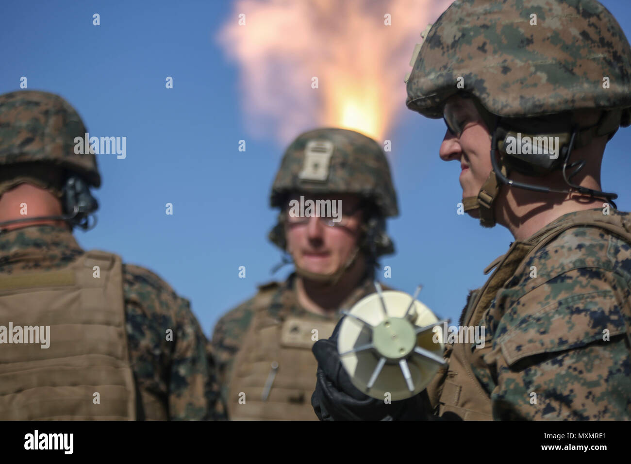 A Marine with Battery B, 1st Battalion, 11th Marine Regiment, reacts to ...