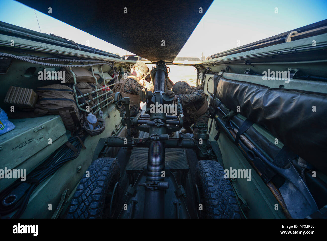 Marines with Battery B, 1st Battalion, 11th Marine Regiment, maneuver ...