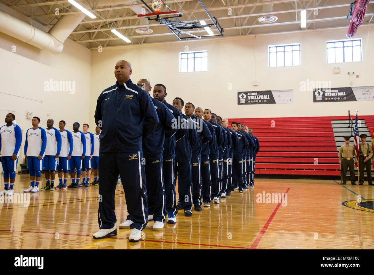U.S. military members of the All Navy basketball team stand in ...