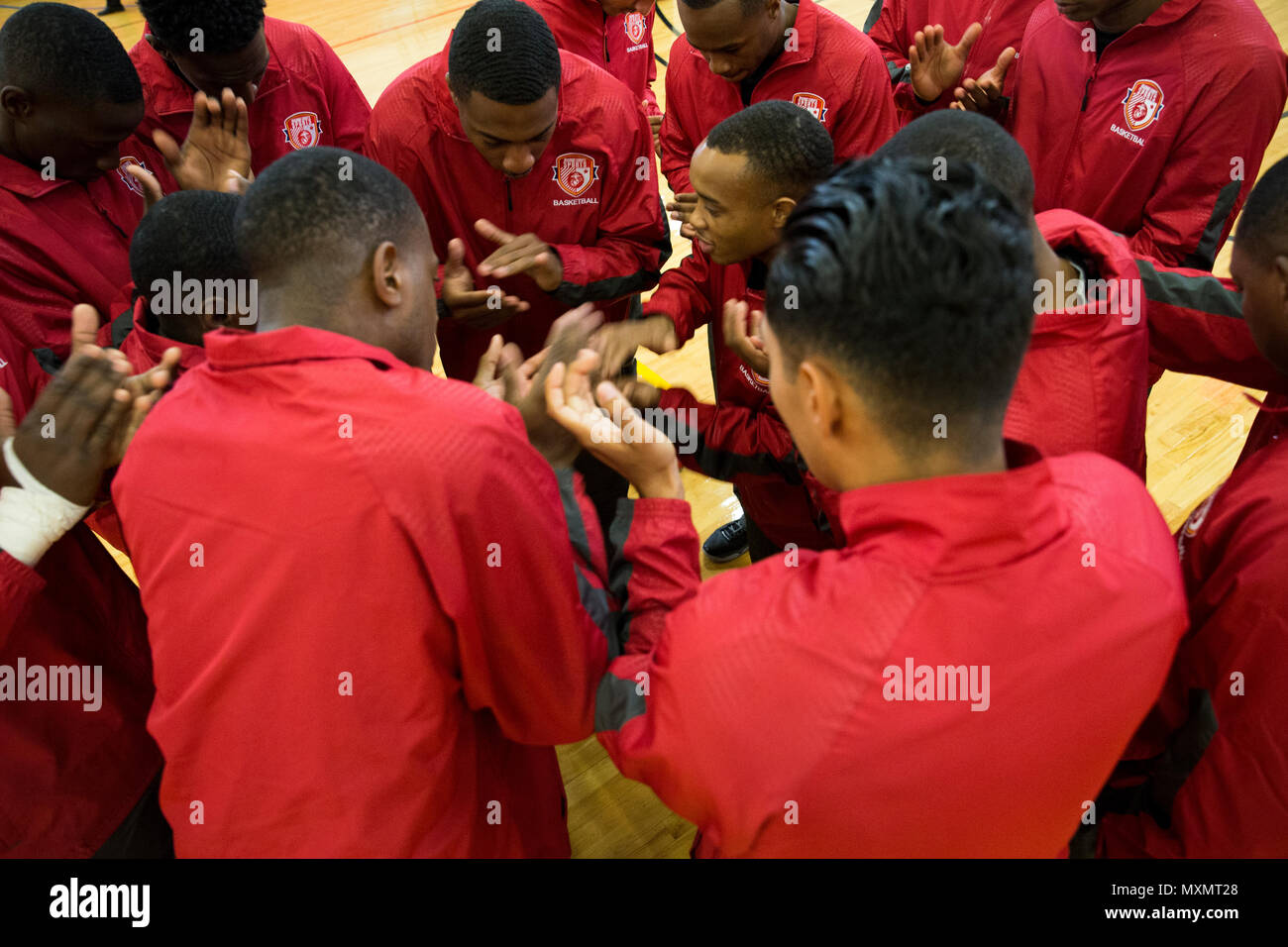 U.S. military members of the All Marine basketball team gather for ...