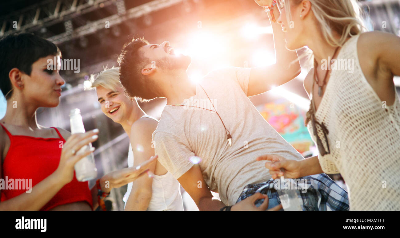 Group of friends having fun time at music festival Stock Photo - Alamy