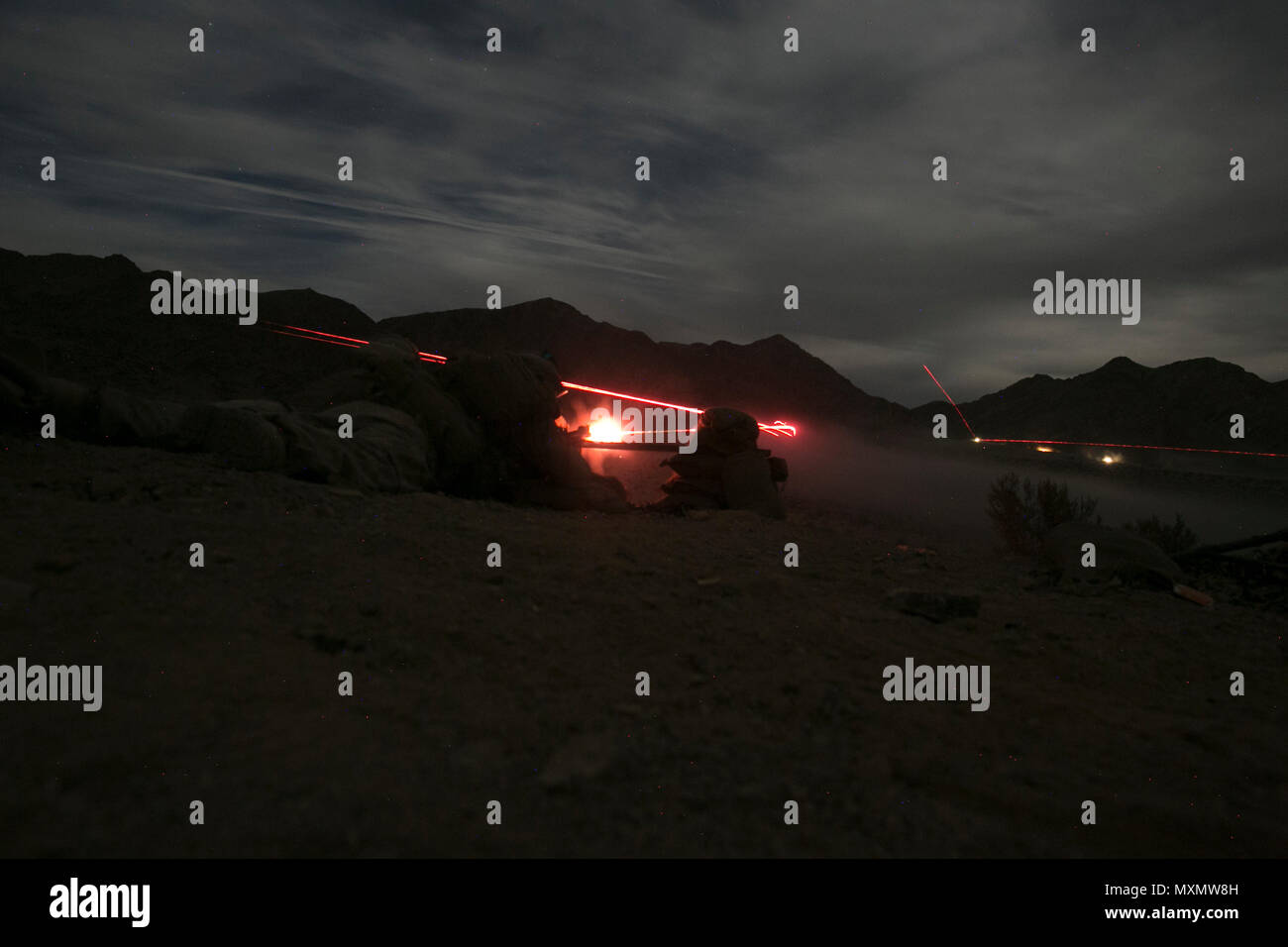 Marines with 1st Battalion, 7th Marine Regiment, fire an M240B medium ...