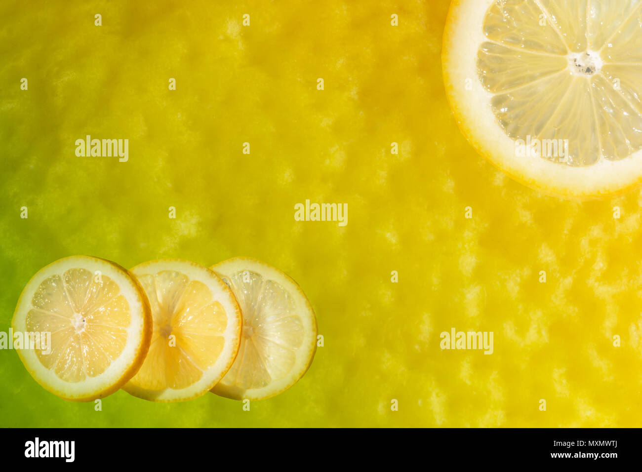 Lemon slices on a lemon skin background ,macro photo ,post production ...
