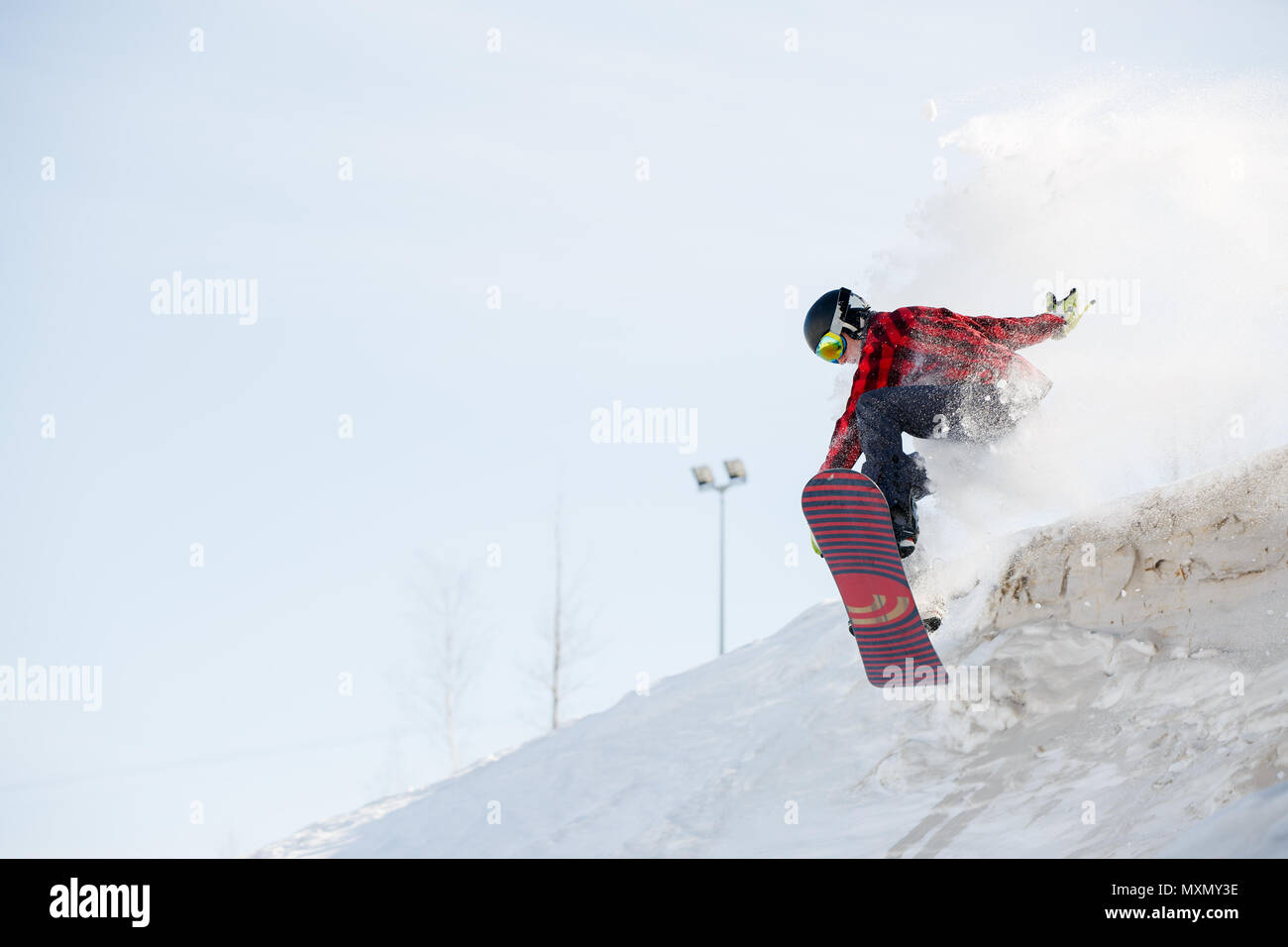 Image of man with snowboard jumping from mountain slope Stock Photo - Alamy