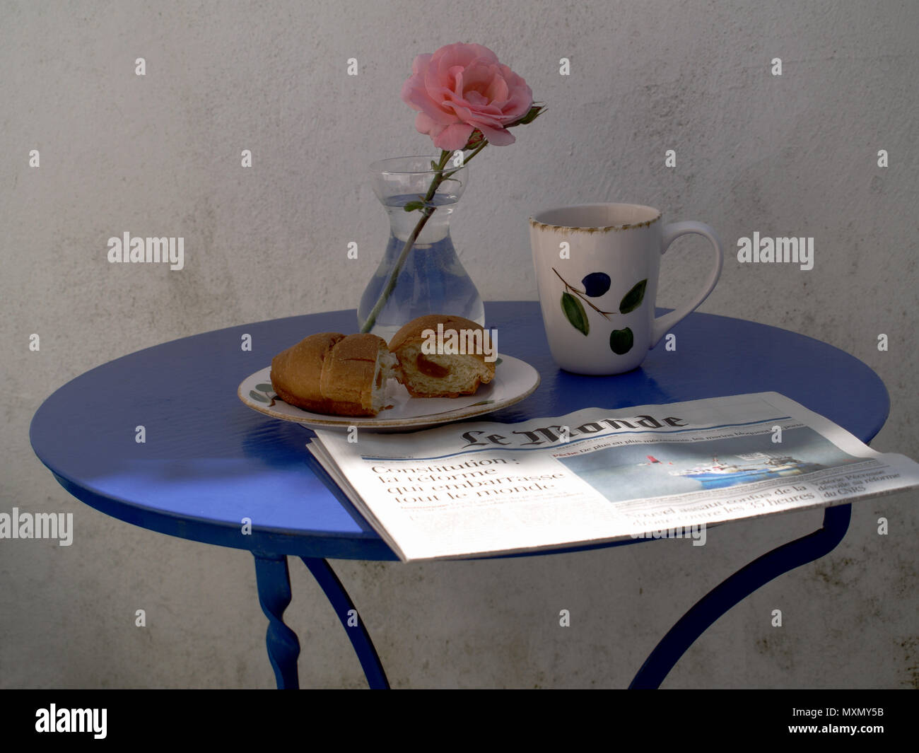 Croissant and coffee continental breakfast in shady corner Stock Photo ...