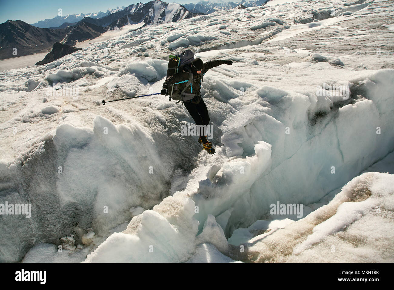 Mountaineer climbing crevasse hi-res stock photography and images - Alamy