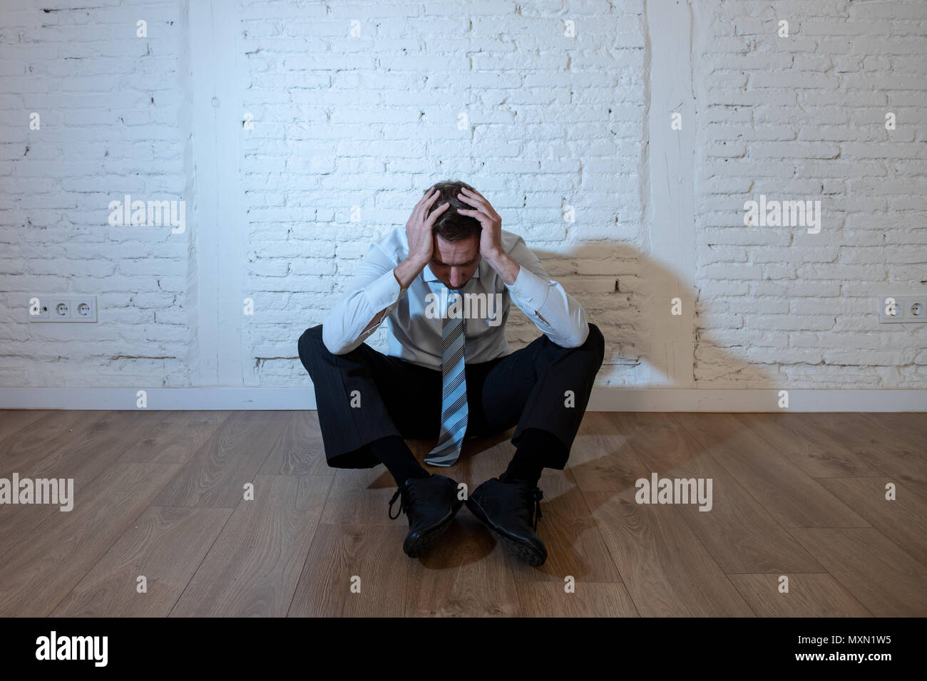 depressed business man feeling sad, lonely and suffering from anxiety ...
