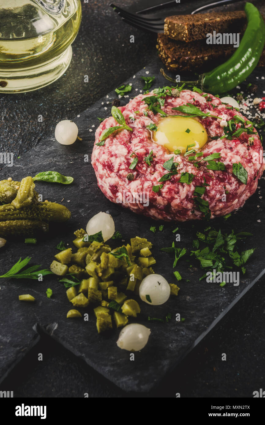 French cuisine, beef steak tartare with raw quail egg yolk, pickled ...