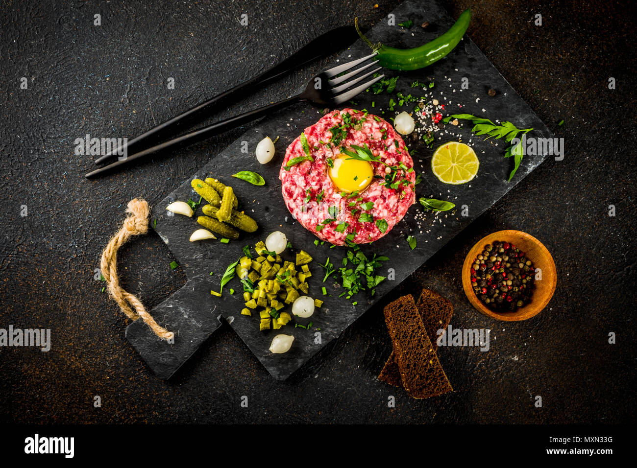 French cuisine, beef steak tartare with raw quail egg yolk, pickled ...