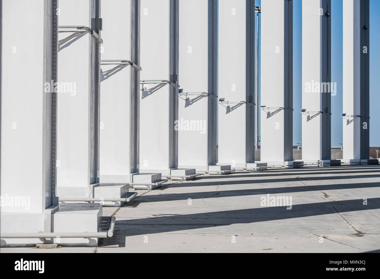 Illumination lamps on pillars. Construction at football Stadium Stock ...