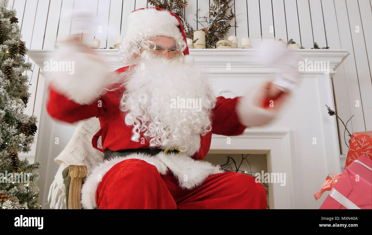 Angry Santa Claus reading a letter and tearing it apart Stock Photo - Alamy