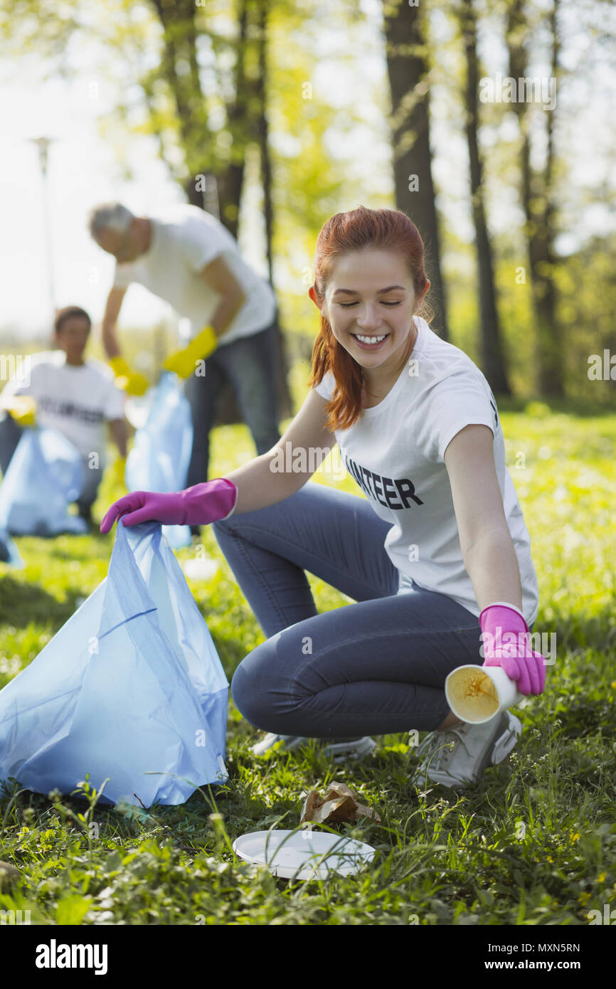 Merry female volunteer saving environment Stock Photo - Alamy