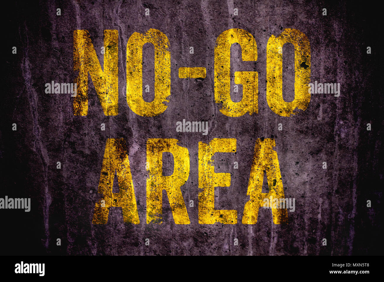 “No-Go Area” warning sign in yellow letters painted over dark grungy ...