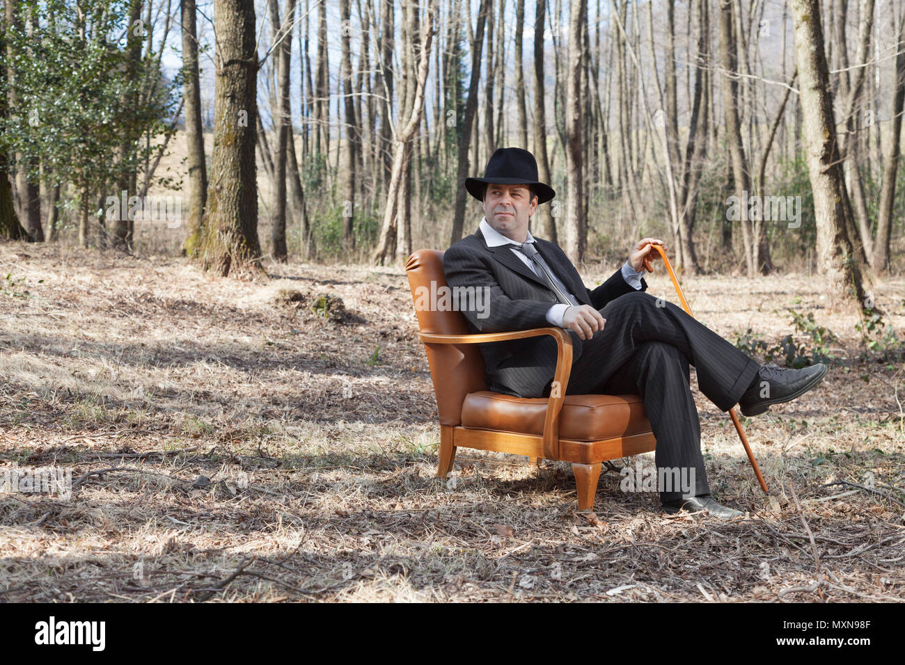Man sitting in leather chair hi-res stock photography and images - Alamy