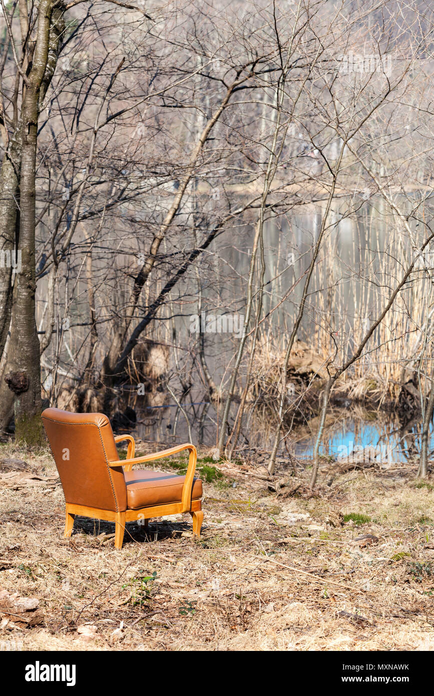Vintage armchair in an autumn forest, scene Stock Photo - Alamy
