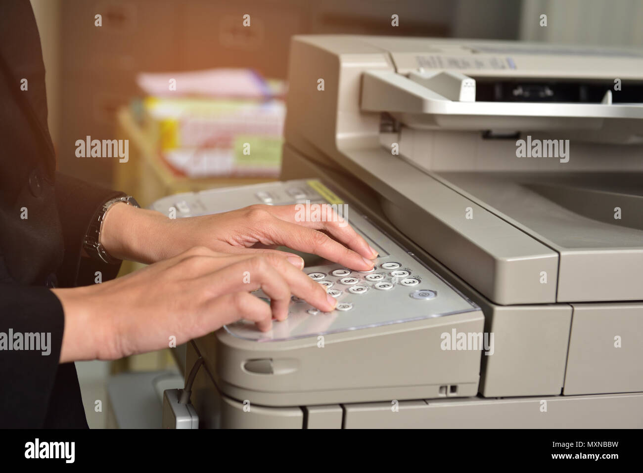Women workers are using a copier in the office Stock Photo - Alamy