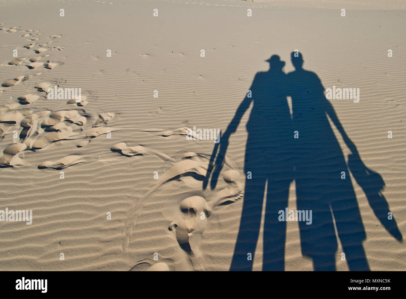 Human shadow on beach hi-res stock photography and images - Alamy