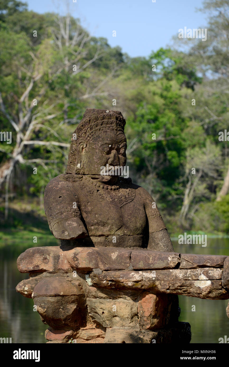 stone face at the Bridge of the south gate to the Angkor Tom city in ...