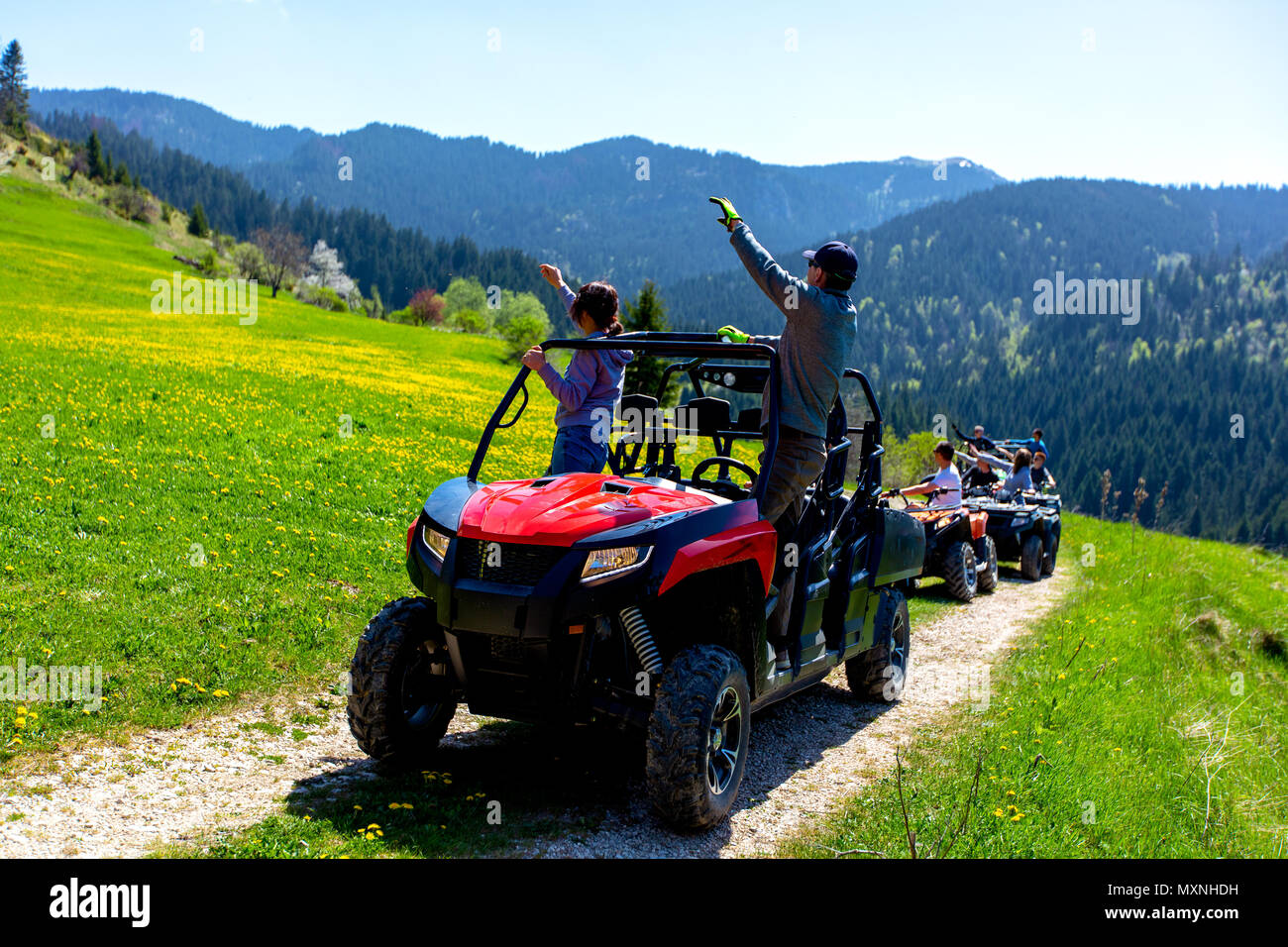 A tour group travels on ATVs and UTVs on the mountains Stock Photo - Alamy