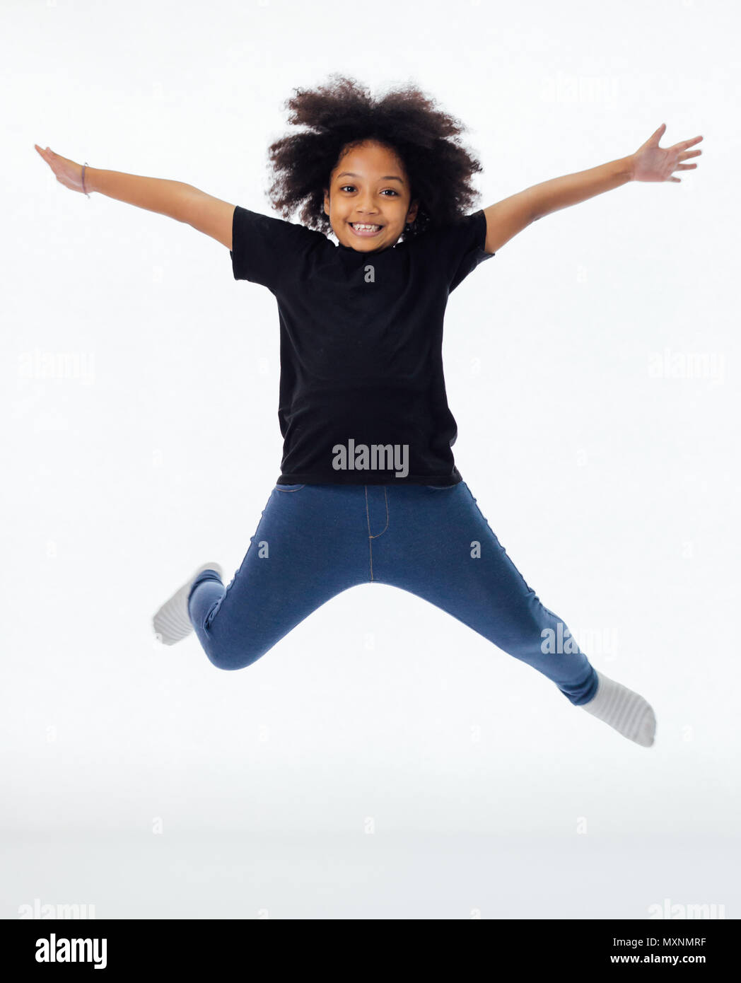 Black kid jumping hi-res stock photography and images - Alamy