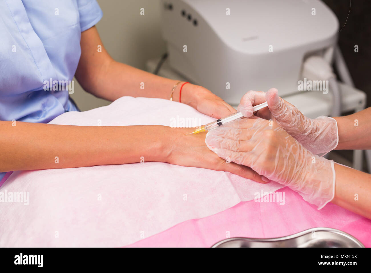 cosmetology and beauty concept - Anti-age injection therapy, hand ...