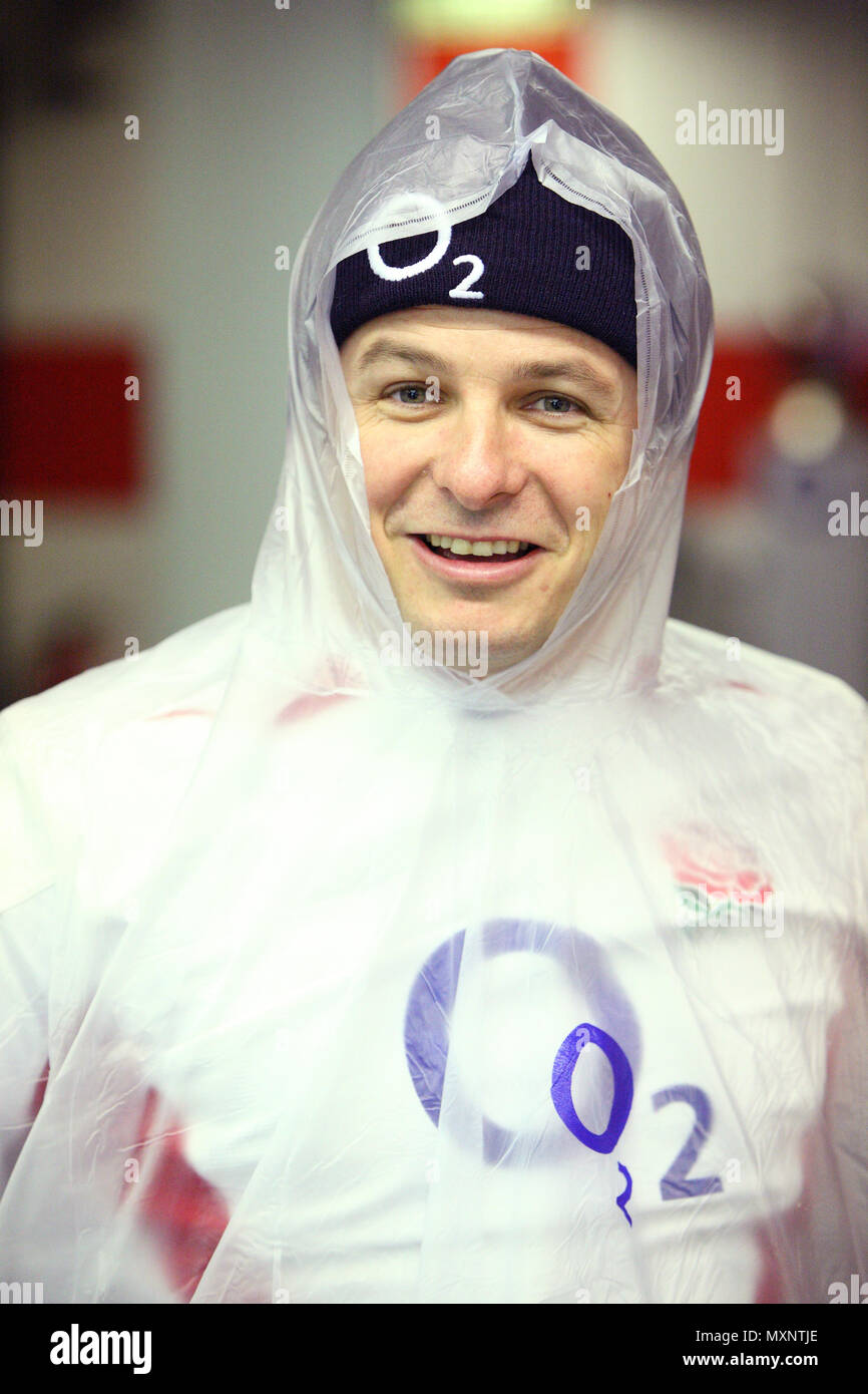 Austin Healey (51 England caps) in an O2 pancho rain cover in the ...