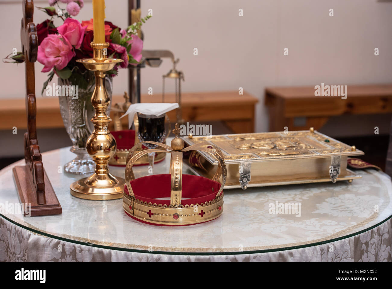 Orthodox objects on a table in a church ready for a wedding ceremony ...