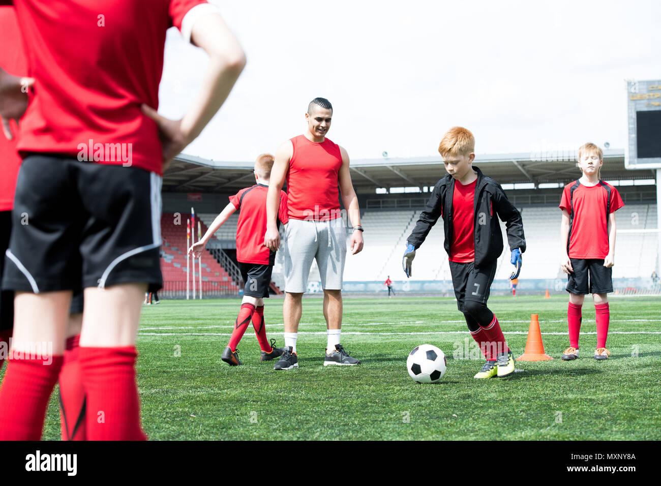 Group of Children at Football Practice Stock Photo - Alamy