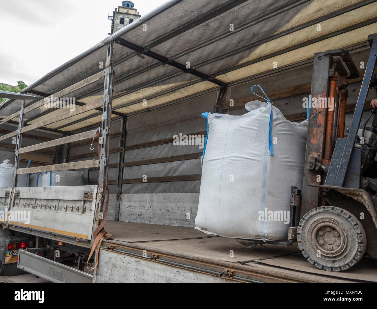 Loading big bags into the truck Stock Photo - Alamy