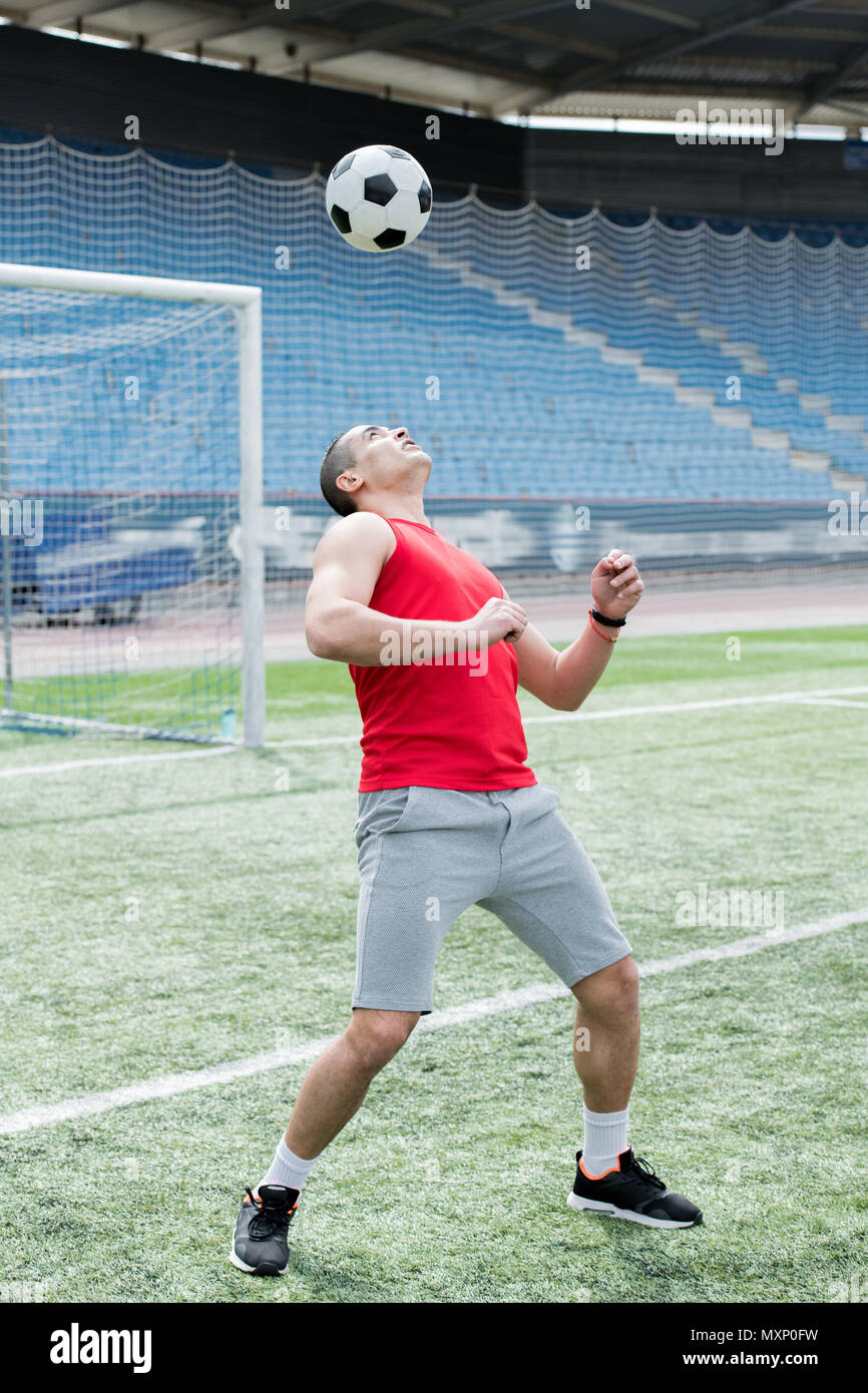 Football player stadium hitting ball hi-res stock photography and ...