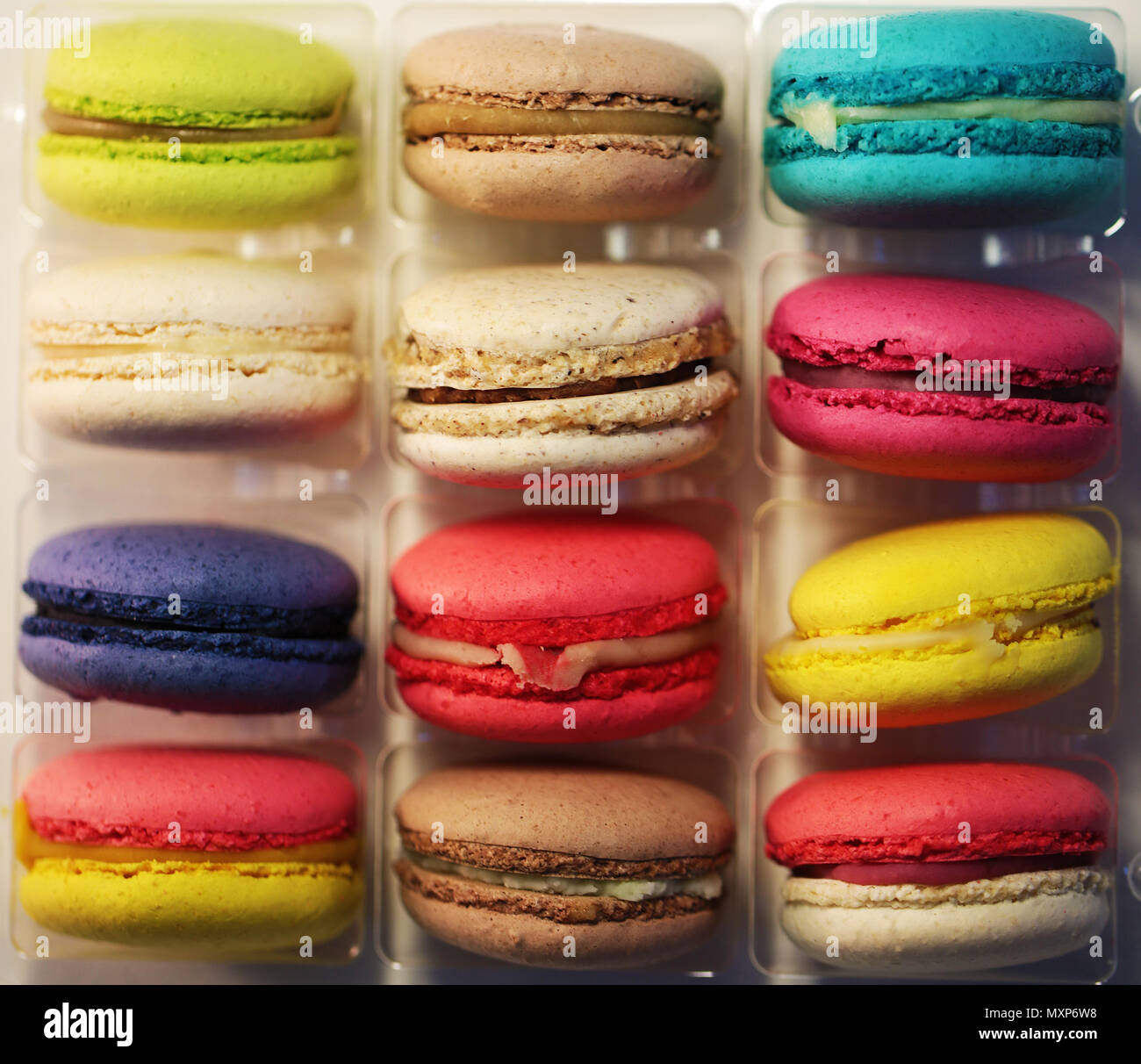 Macaroons of different colors packed in plastic bag Stock Photo - Alamy