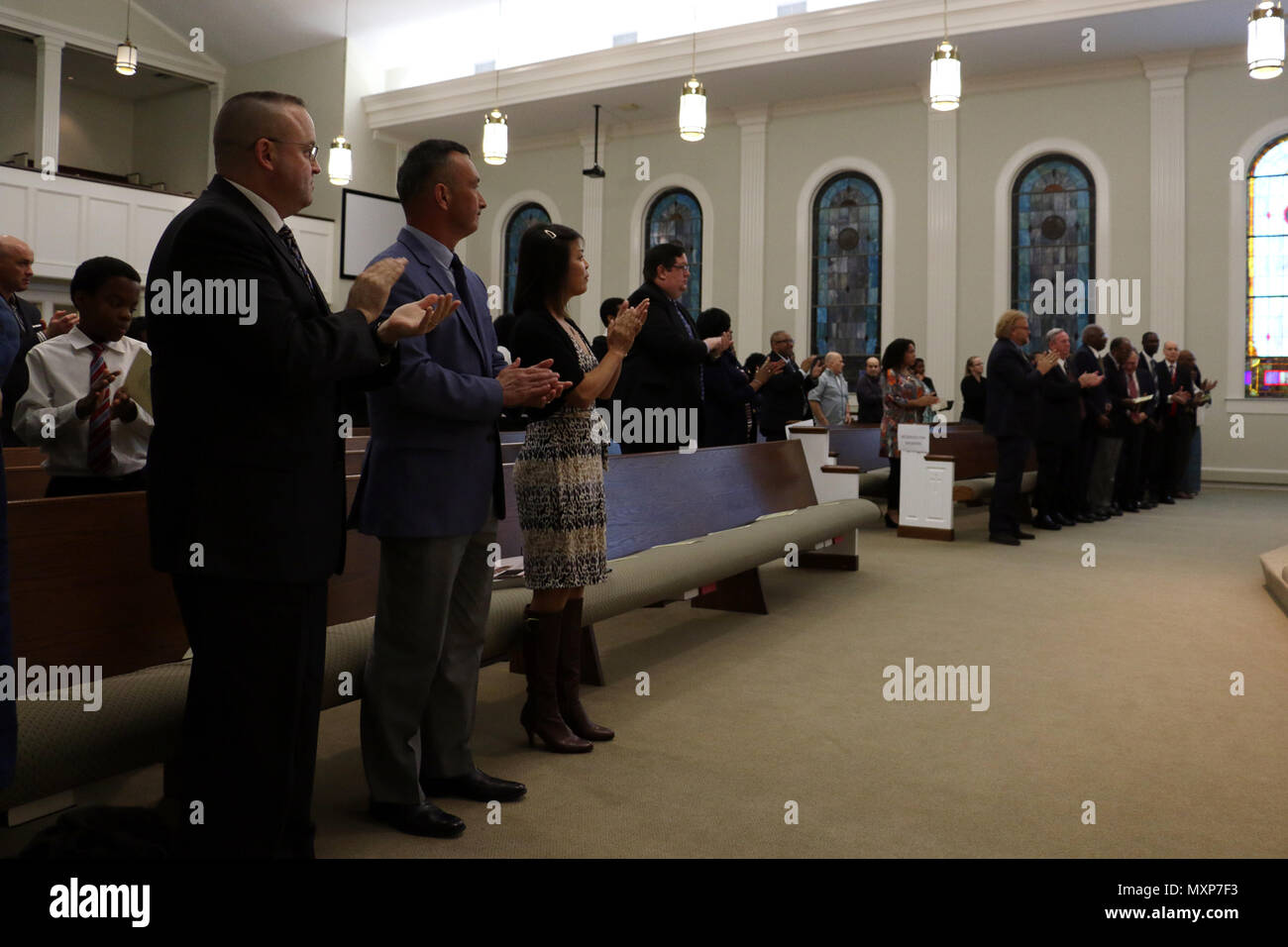 Attendees of the 14th annual Mayor’s Thanksgiving Program applaud after ...