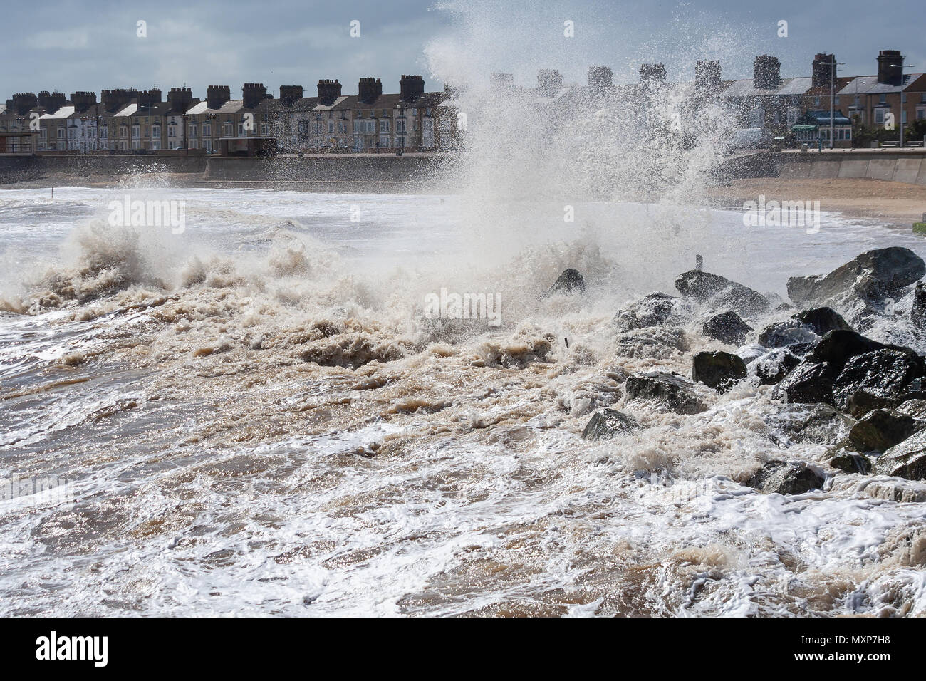 An English coastal view with rough seas creating spray Stock Photo - Alamy