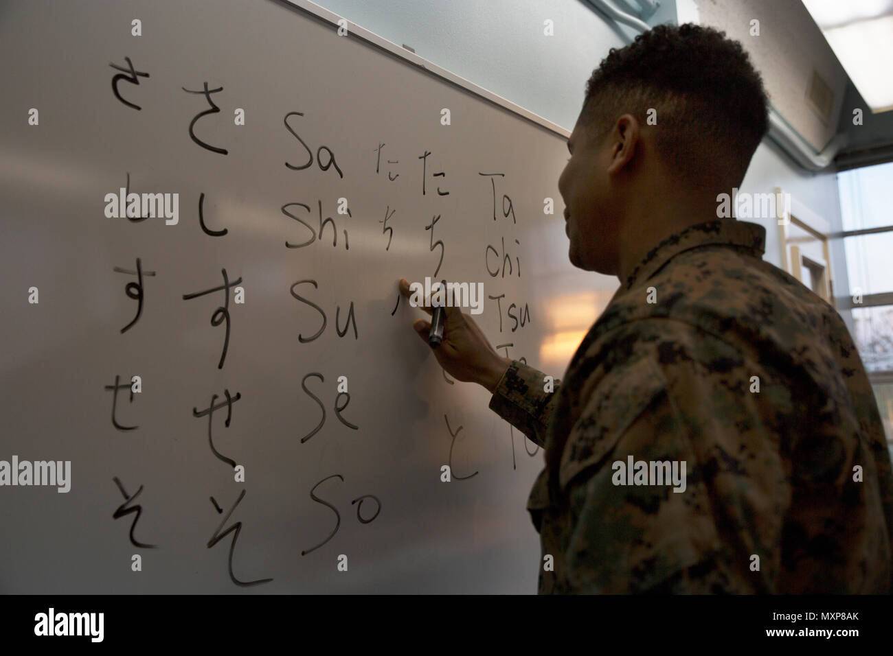 Cpl. Quindrell Fulton practices writing Japanese hiragana characters on ...