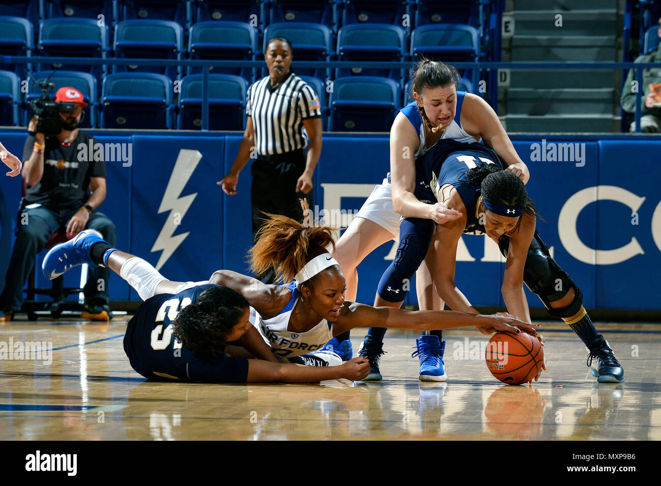 Dee Bennett, a junior, battles for the ball as Air Force hosted Navy at ...