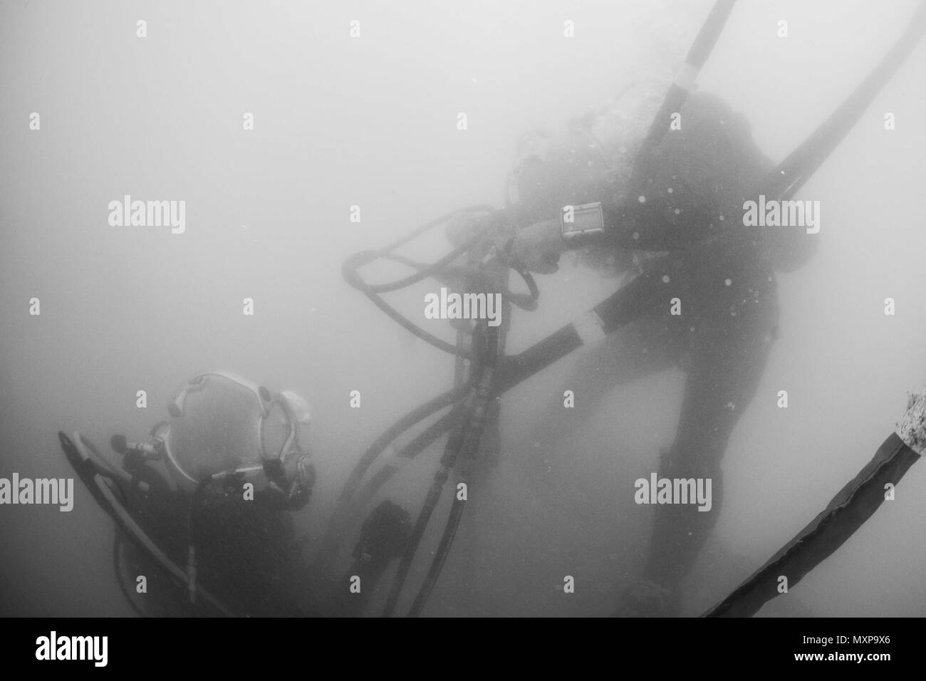 Petty Officer 1st Class Matt Ramirez, right, assigned to Underwater ...