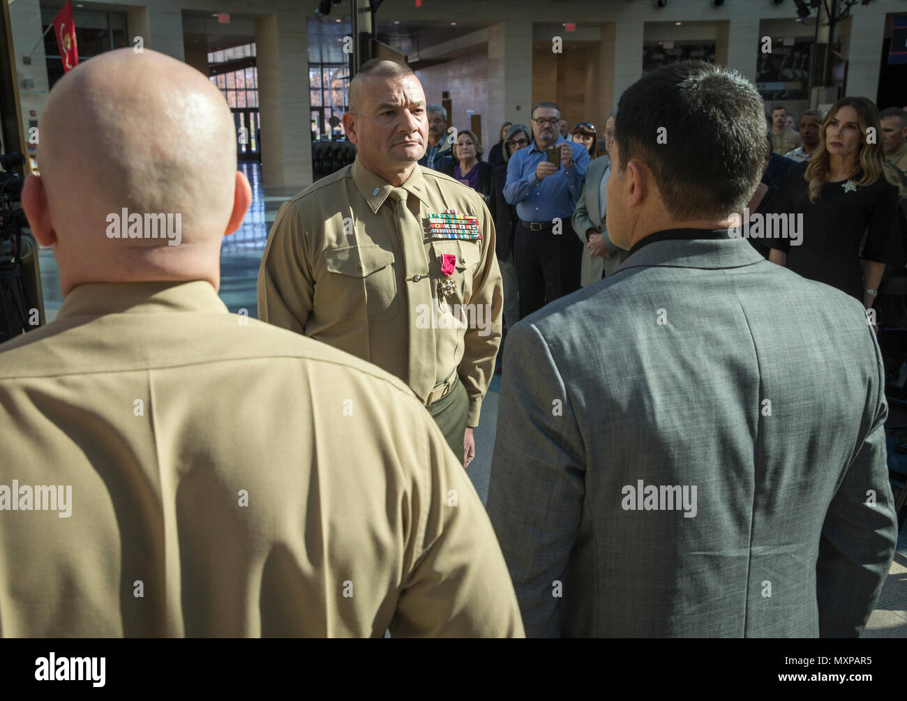 U.S. Marine Corps Chief Warrant Officer 5 Ray Gulcynski, center ...